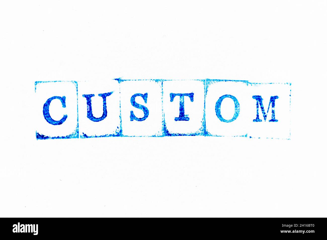 Blue color ink rubber stamp in word custom on white paper background ...