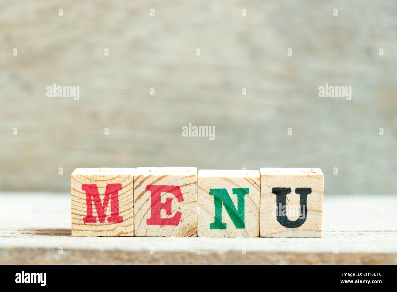 Alphabet letter block in word menu on wood background Stock Photo - Alamy