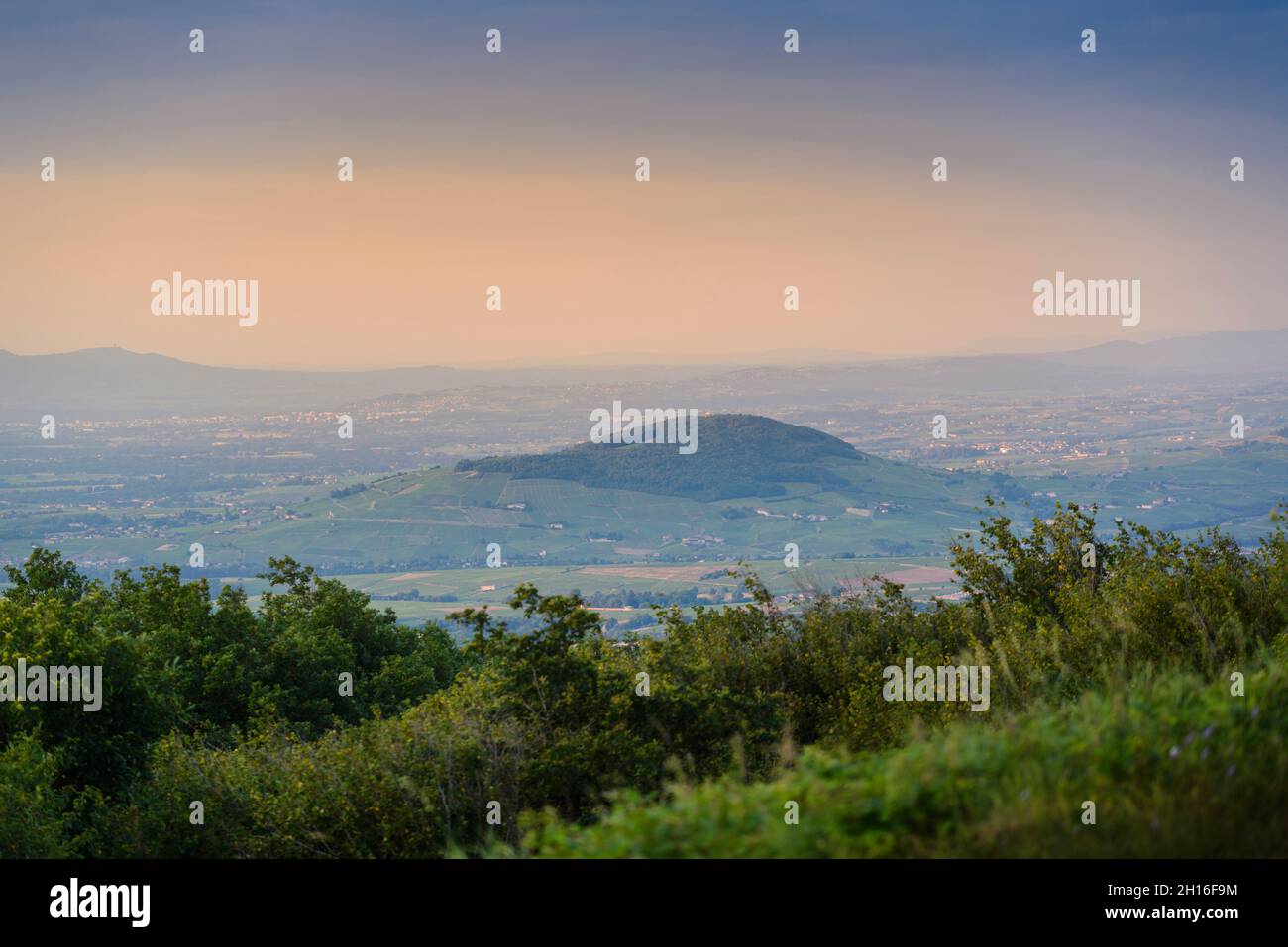 Le Mont Brouilly lit up by early morning light, Beaujolais Stock Photo ...