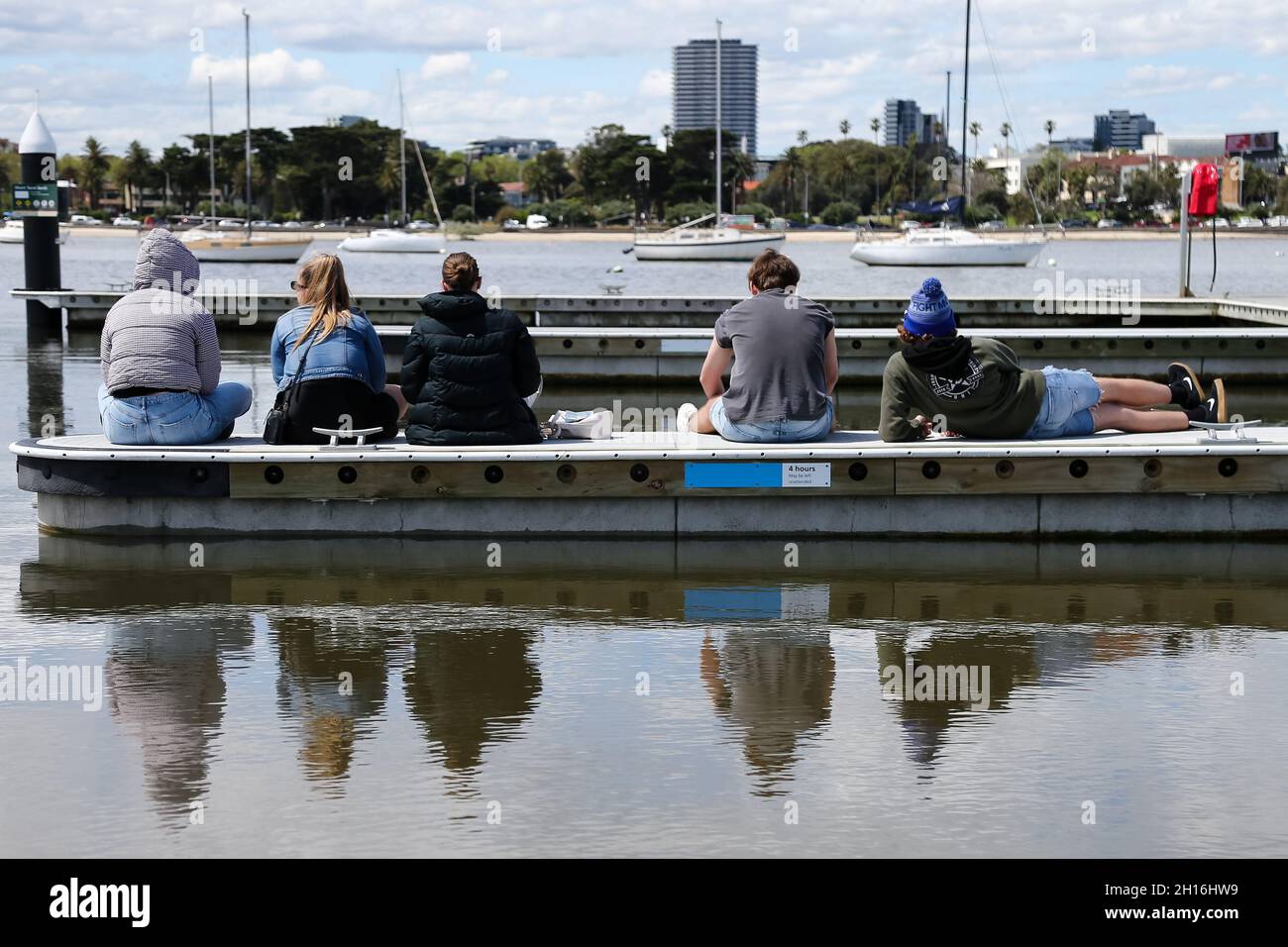 Melbourne, Australia. 17th Oct, 2021. Friends are seen relaxing on one ...