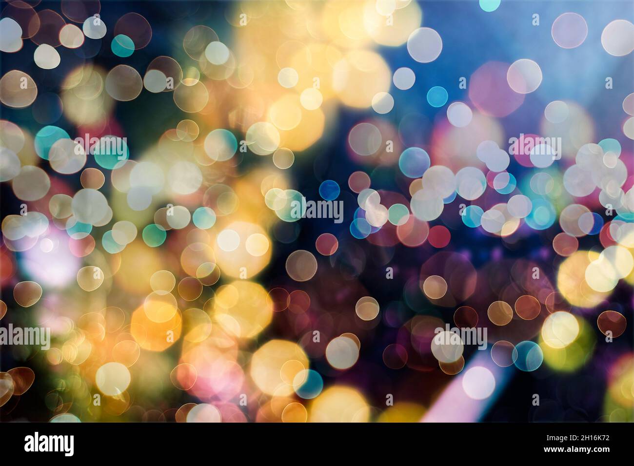 Abstract light celebration background with defocused golden lights for ...