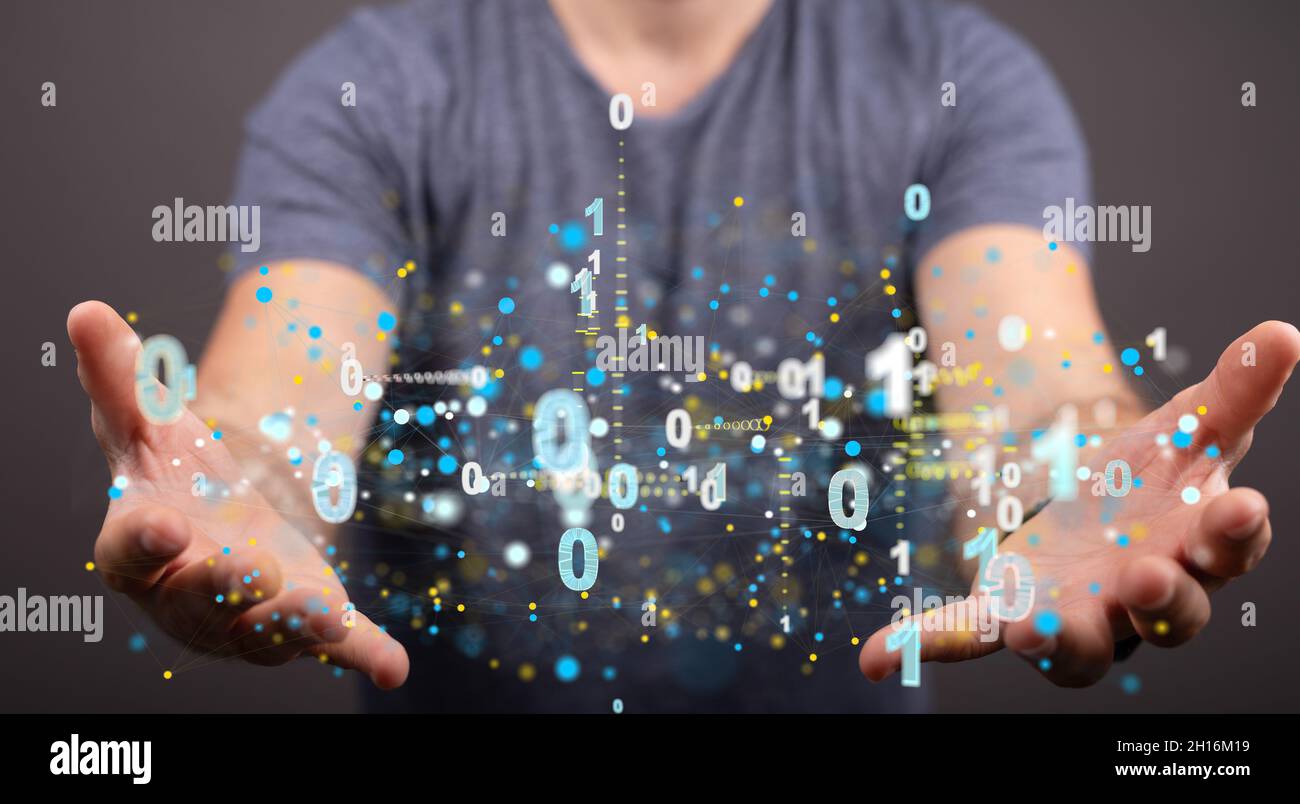 A person presenting the virtual projection of digital binary codes ...