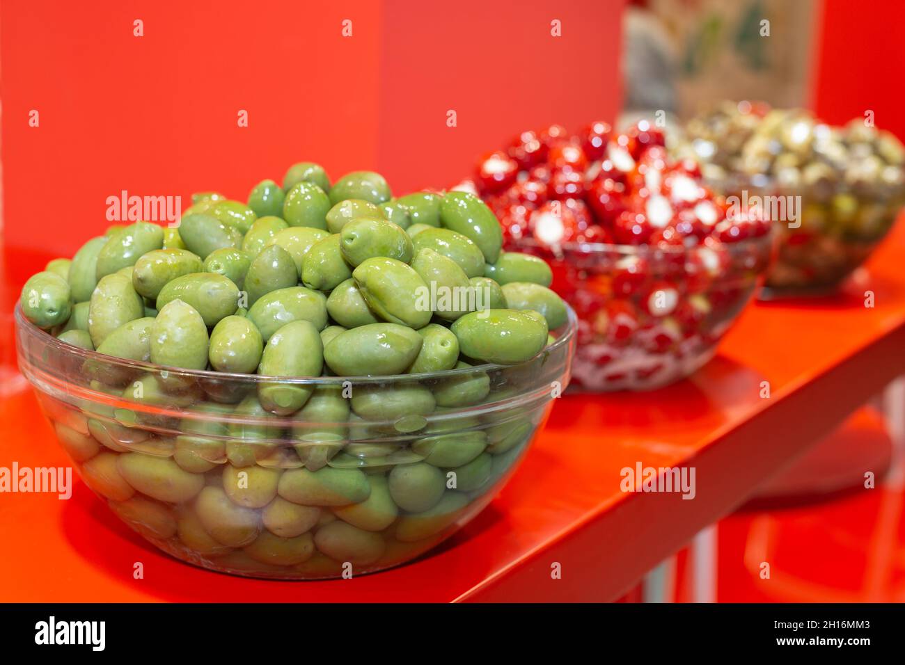 Natural Green Olives inside Glass Round Container Stock Photo - Alamy