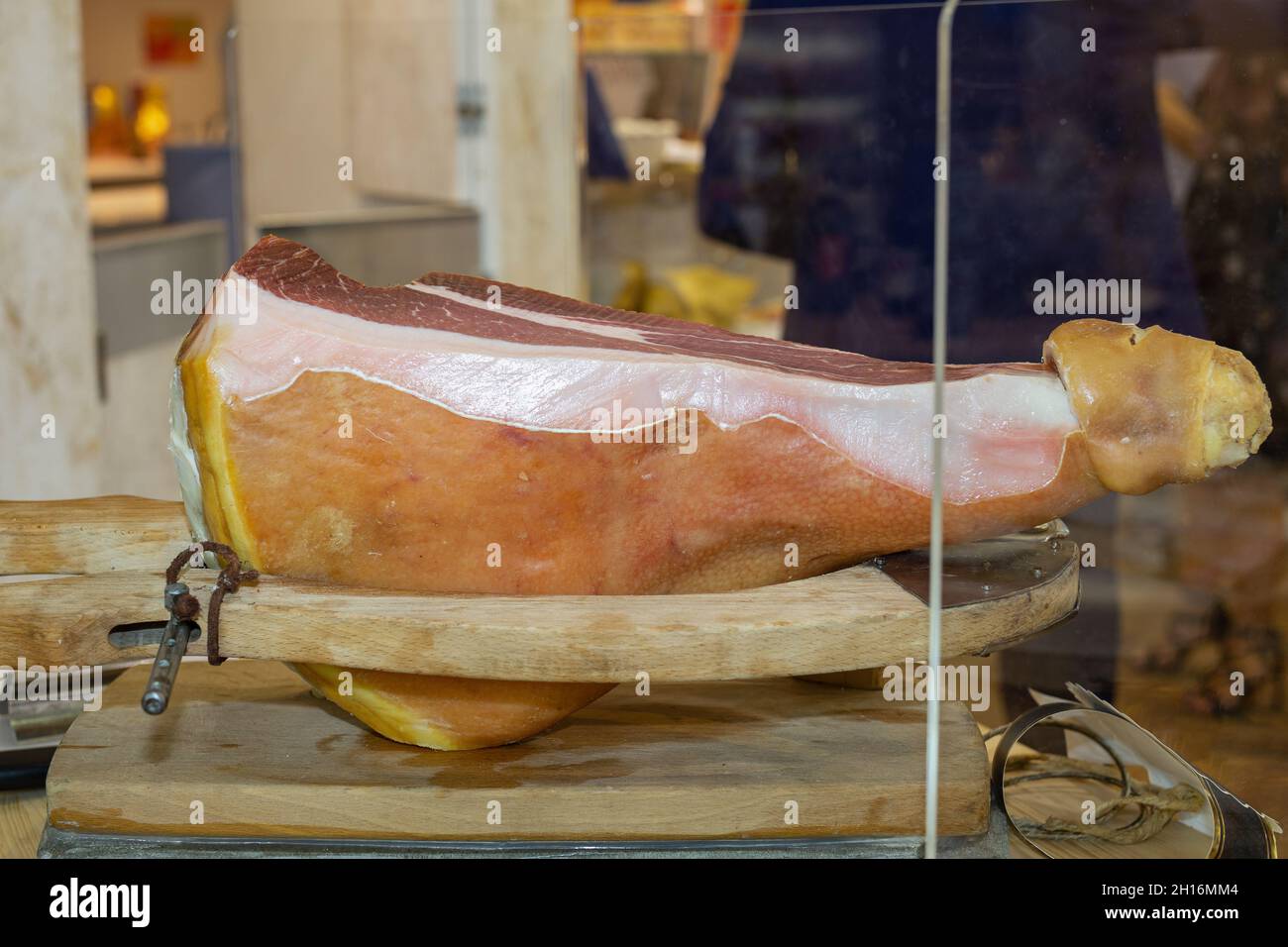 Raw Ham Leg inside Cutting Holder Stock Photo - Alamy