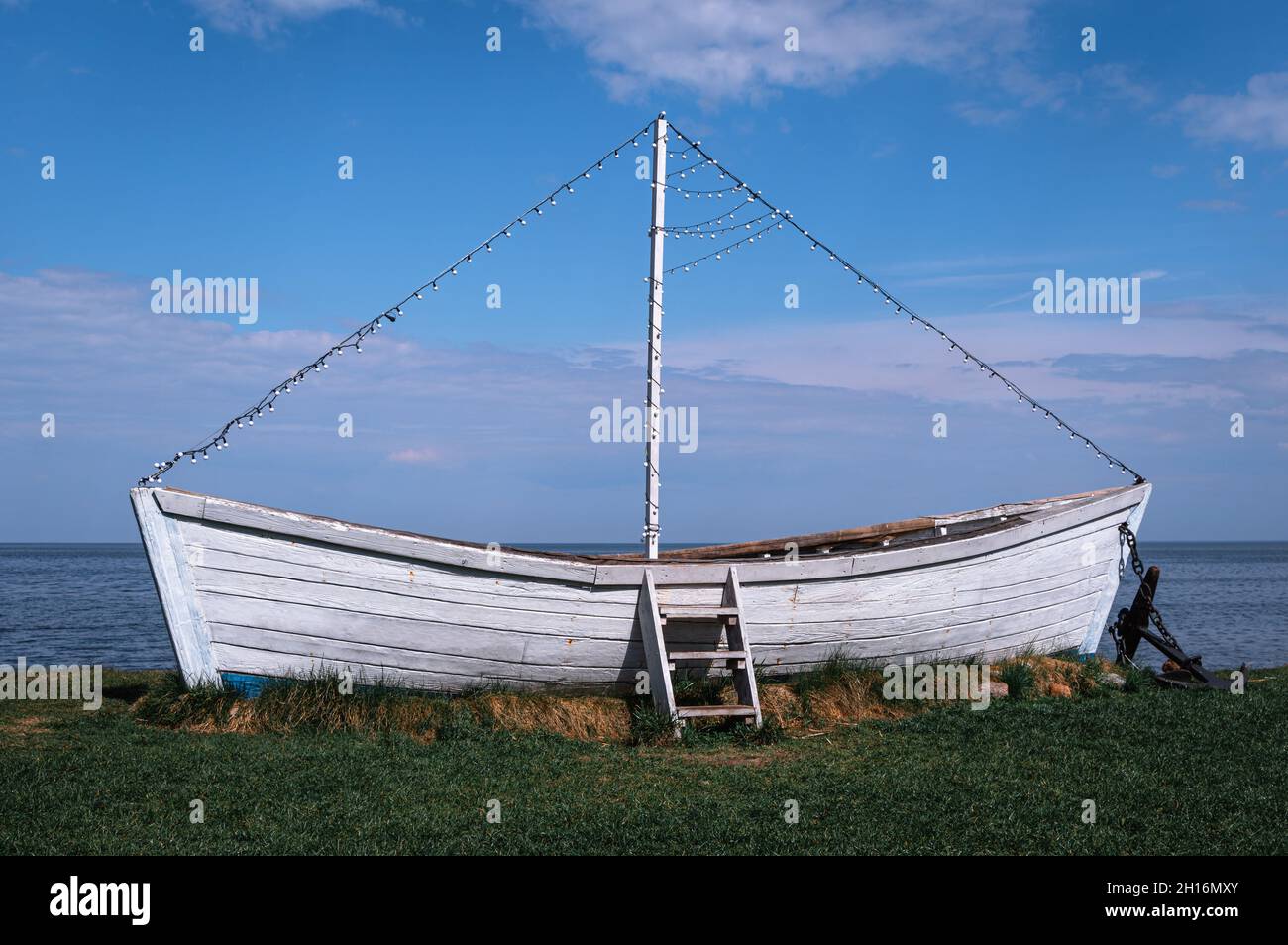 Lonely wooden boat on the Baltic Sea coast in the Curonian Spit ...