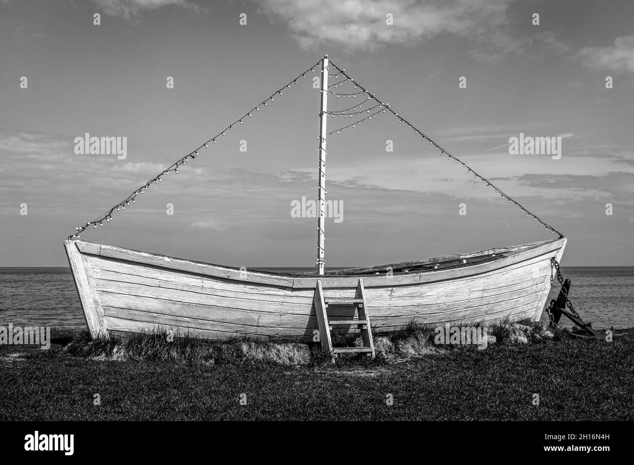 Lonely wooden boat on the Baltic Sea coast in the Curonian Spit ...
