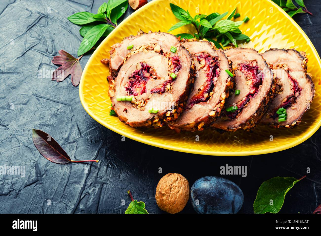 Slice meatloaf baked with autumn plum and nuts.Festive meat roll Stock ...