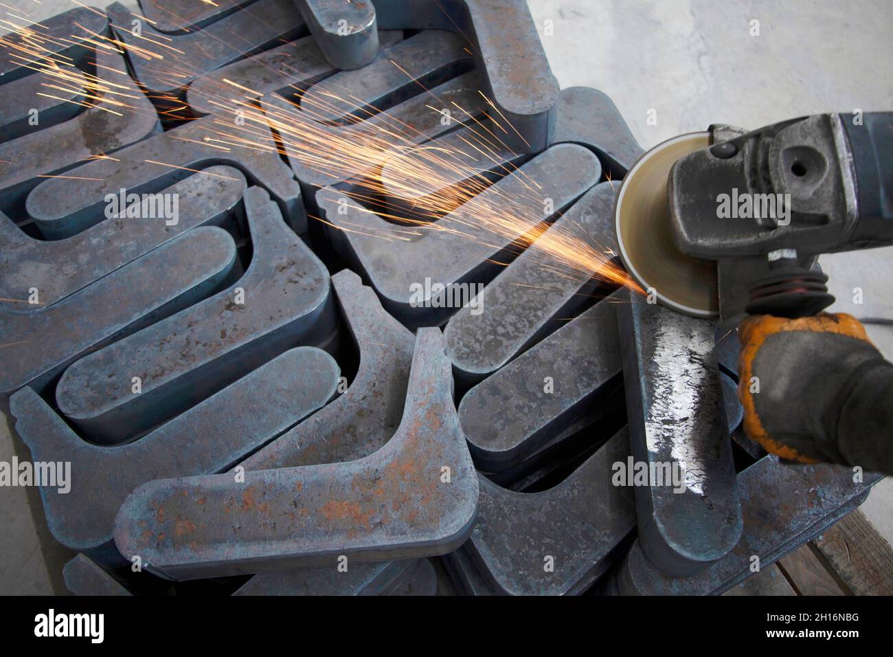Grinding metal construction in workshop Stock Photo - Alamy