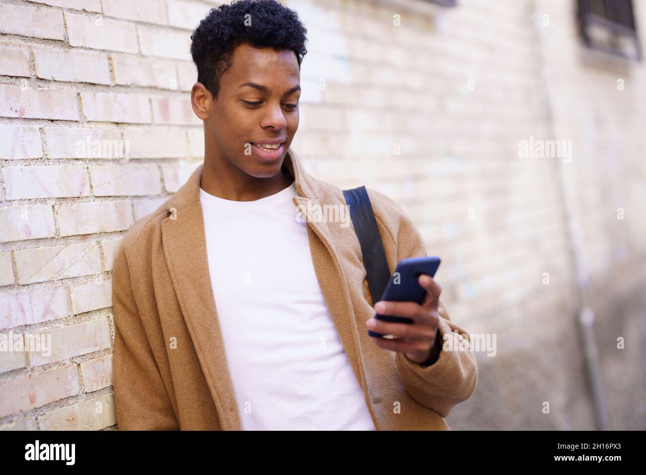 Happy smiling cuban young man hi-res stock photography and images - Alamy