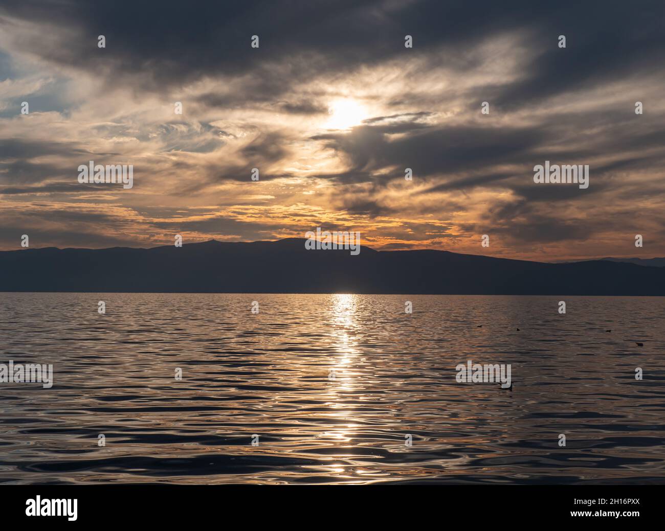 Beautiful calm lake with sunset, natural background Stock Photo - Alamy