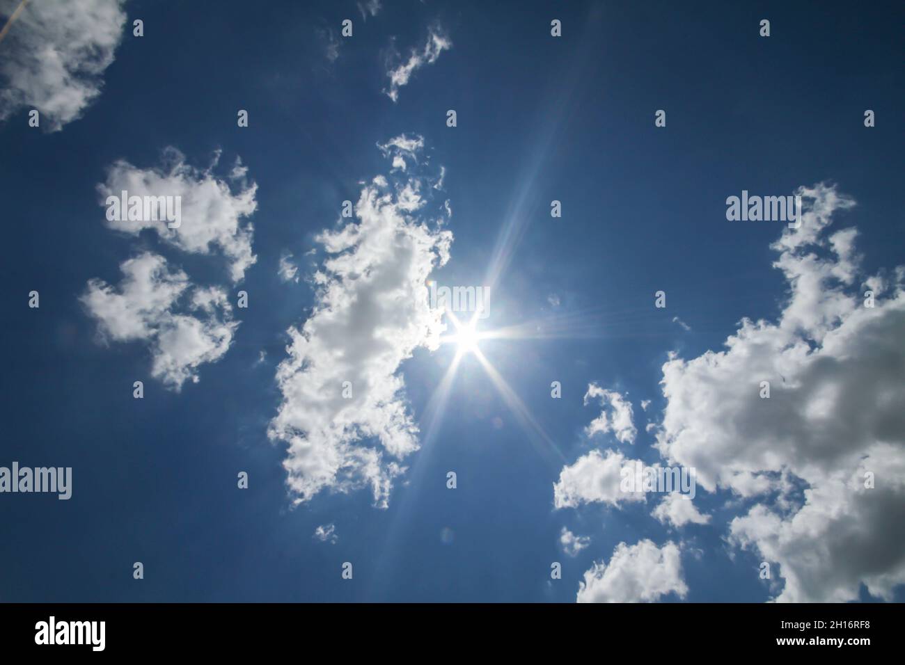 natural clouds blue sky sun ray light Stock Photo - Alamy