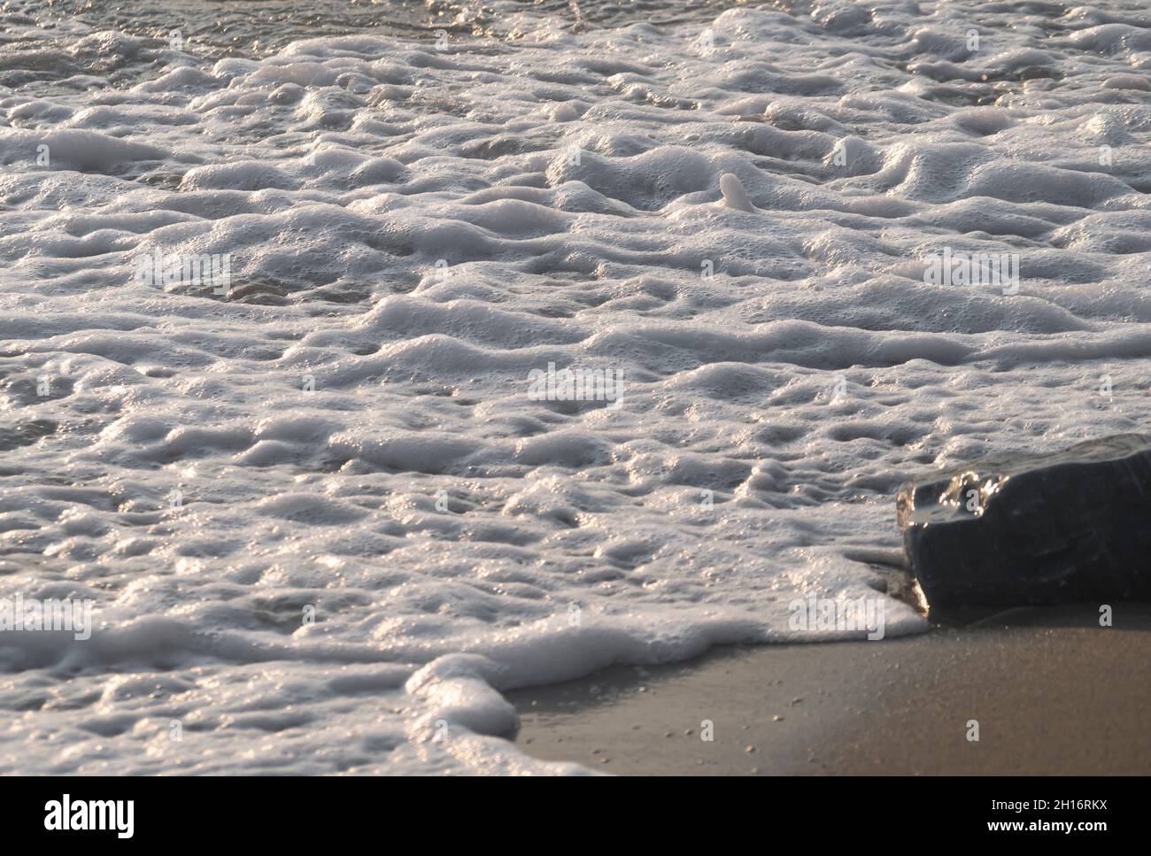 wave splash sea beach macro, close up Stock Photo - Alamy