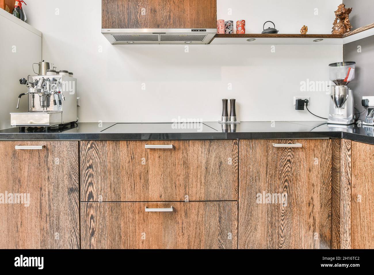 Light kitchen with wood texture and different appliances in bright ...