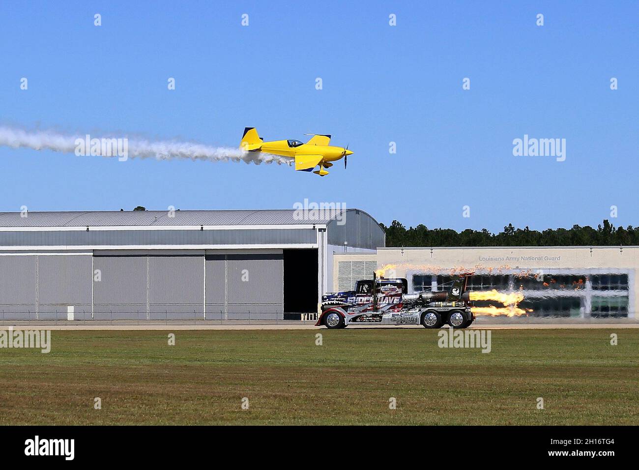 Hammond, USA. 16th Oct, 2021. An Extra 300 SHP plane races with a ...