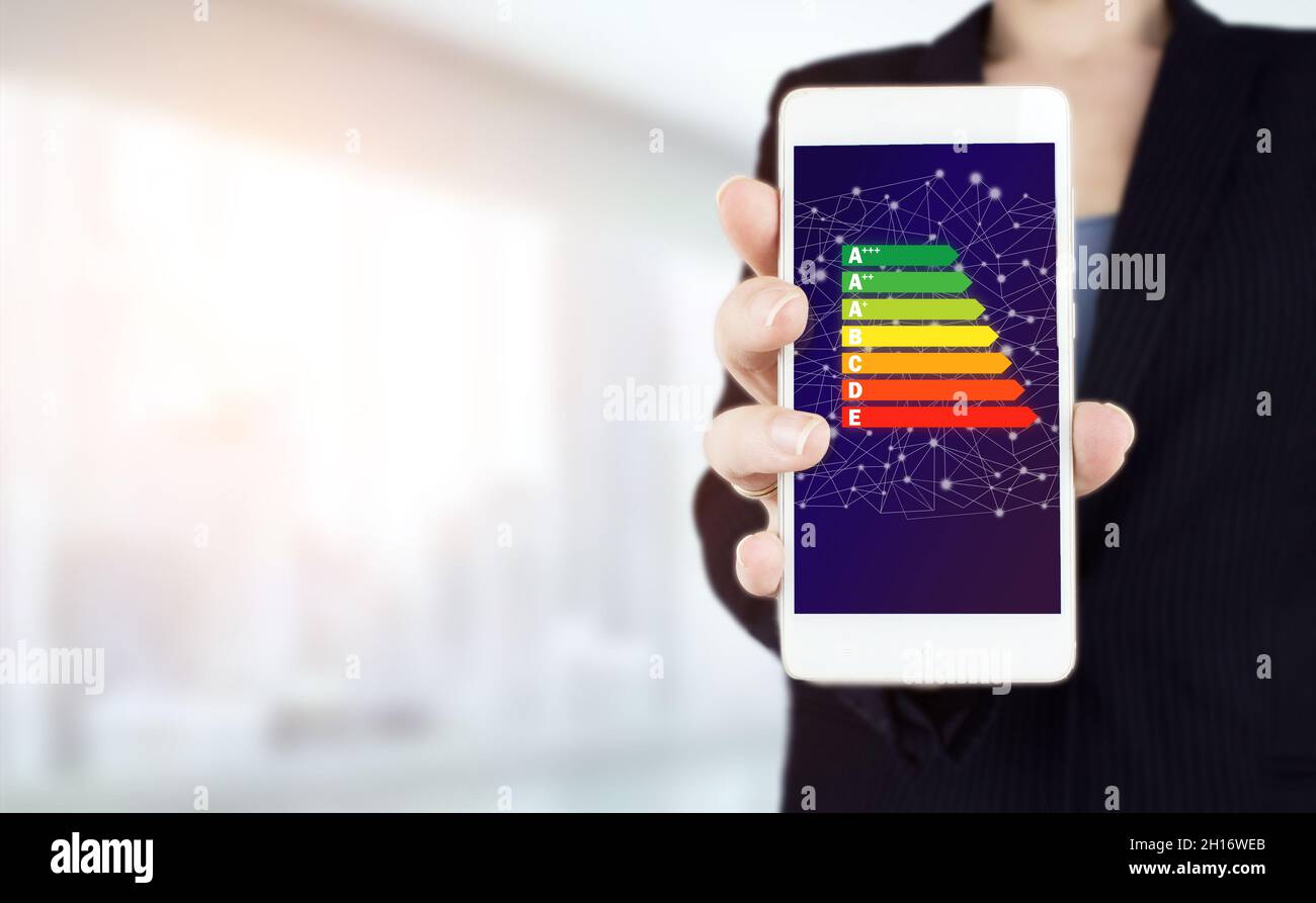 Good energy chart rating. Hand hold white smartphone with digital ...