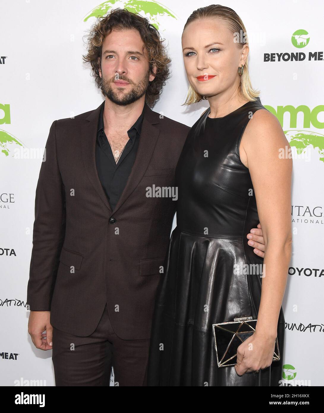 (L-R) Jack Donnelly and Malin Åkerman arrives at the 2021 Environmental ...