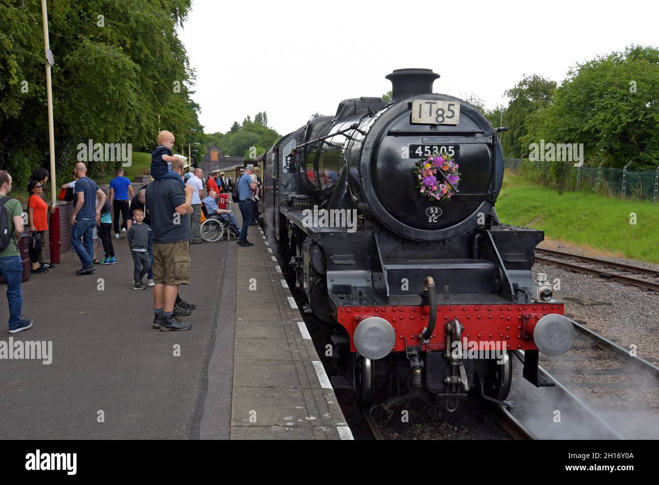 Rail enthusiasts watching ex LMS "8F" steam locomotive 48305 at the ...