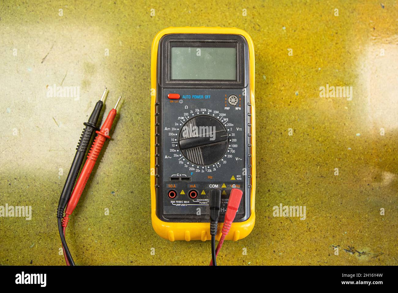 From above of modern plastic device called multimeter with black and ...
