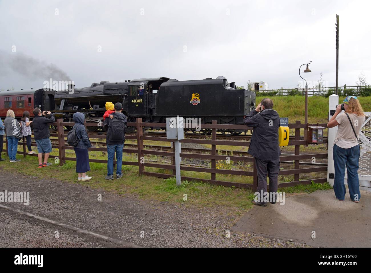 Rail enthusiasts photographing ex LMS "8F" steam locomotive 48305 at ...