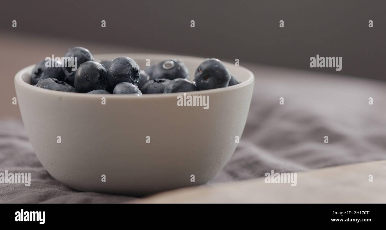 washed ripe blueberries in white bowl wit copy space, wide photo Stock ...