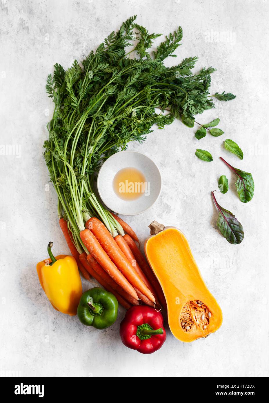 Back view of young lady in sportswear with earphones and smartphone ...