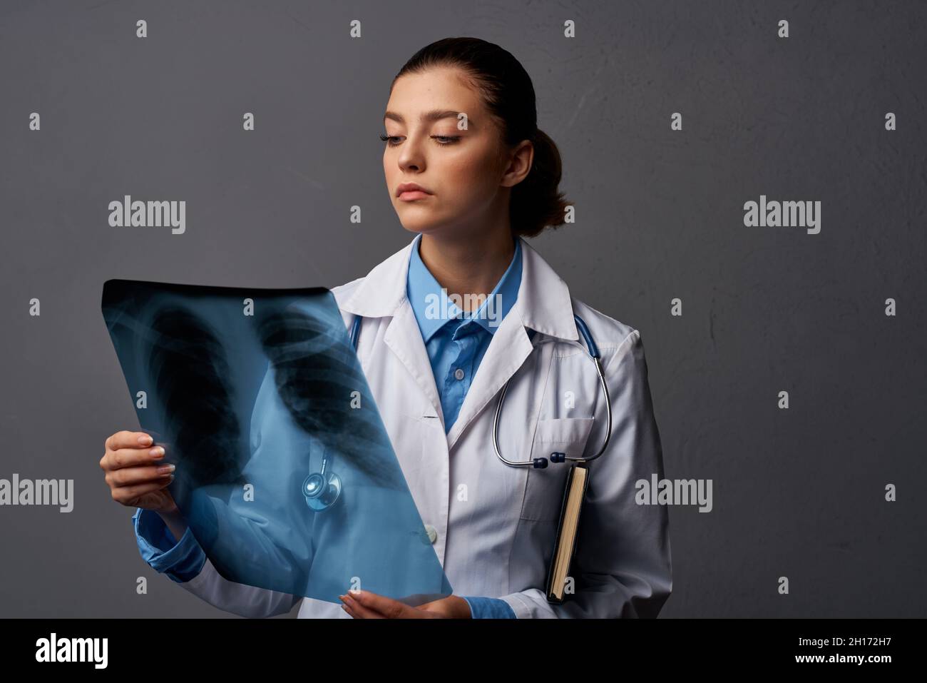 female doctor with x-ray health care light background Stock Photo - Alamy