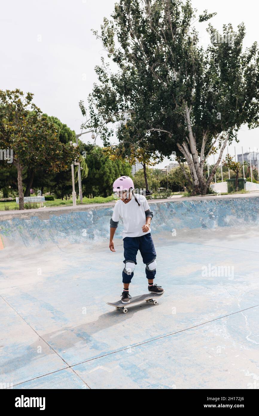 Full body of young ethnic person in casual outfit wearing protective ...