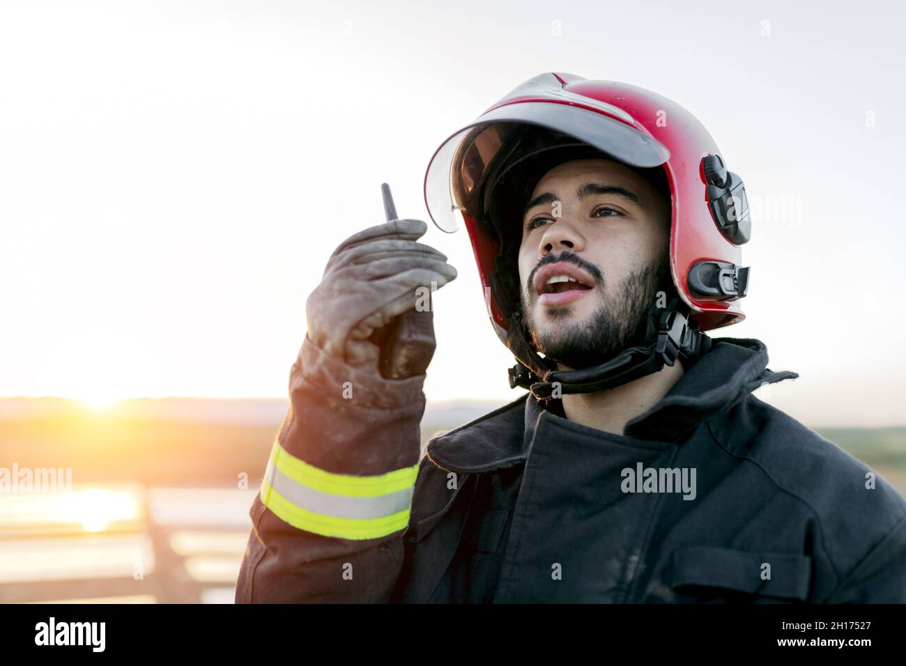 Firefighter with helmet hi-res stock photography and images - Alamy