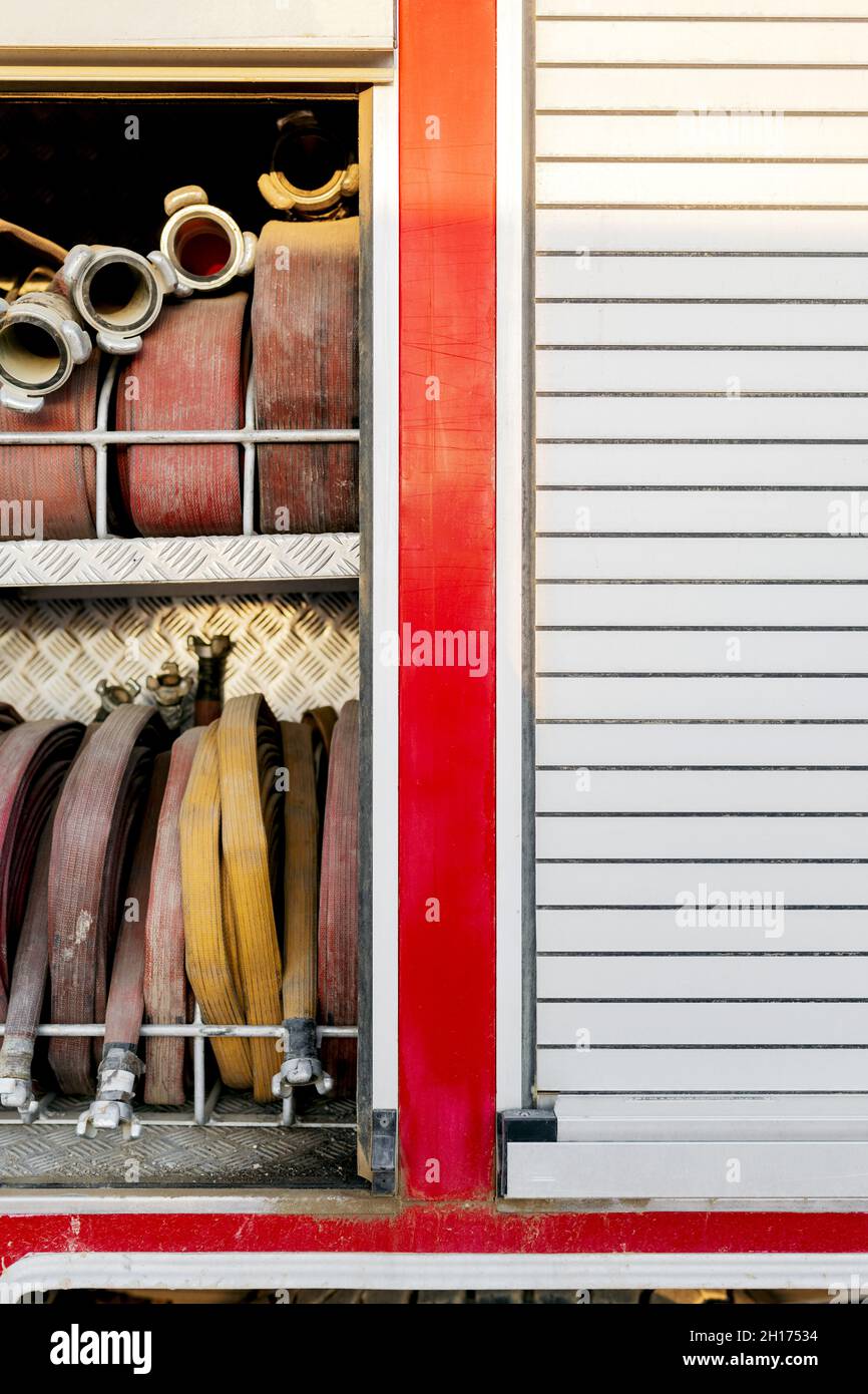 Section with various types of twisted fire hoses and different types of ...