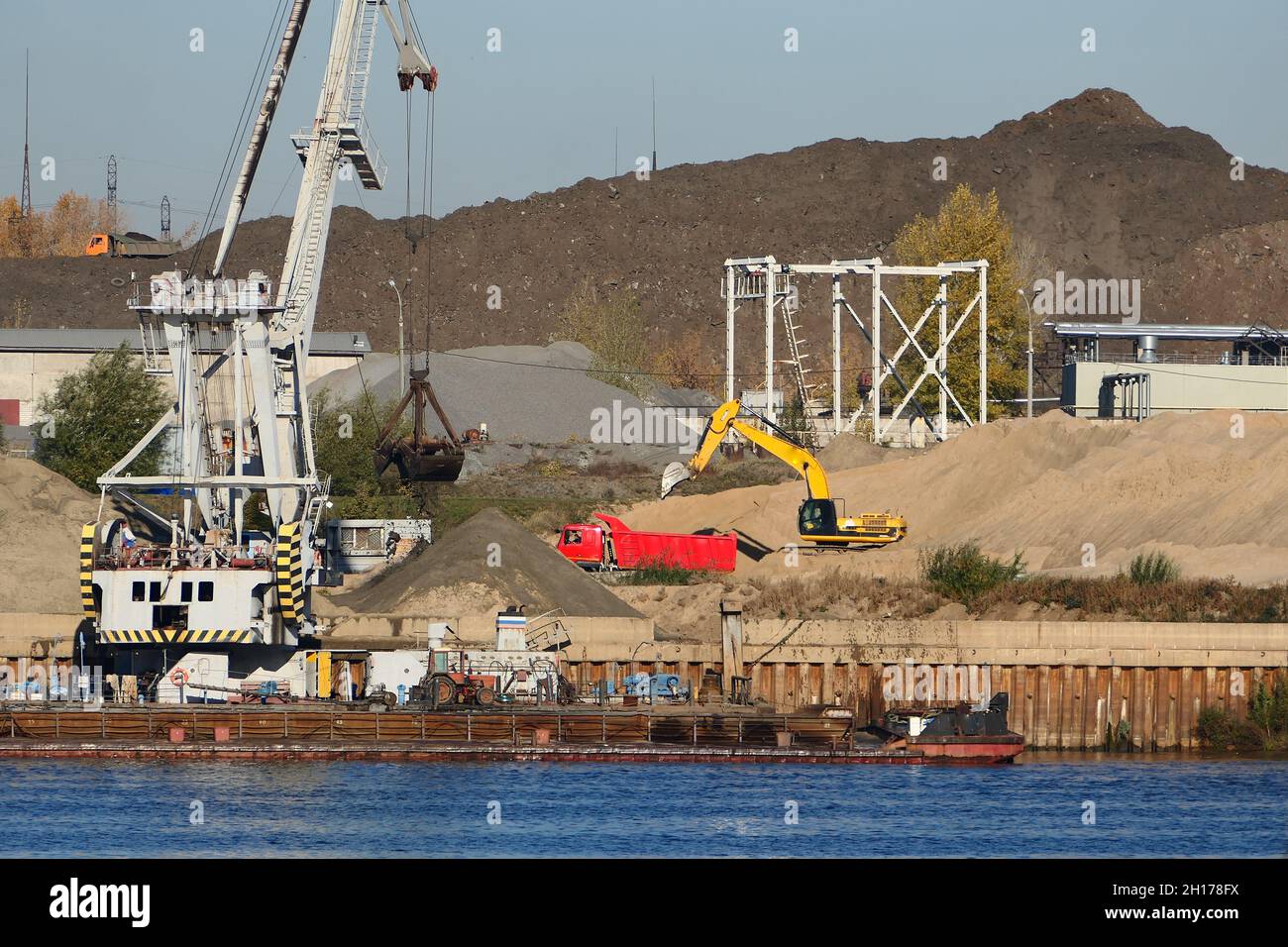 Construction structures on the banks of the river. High quality photo ...