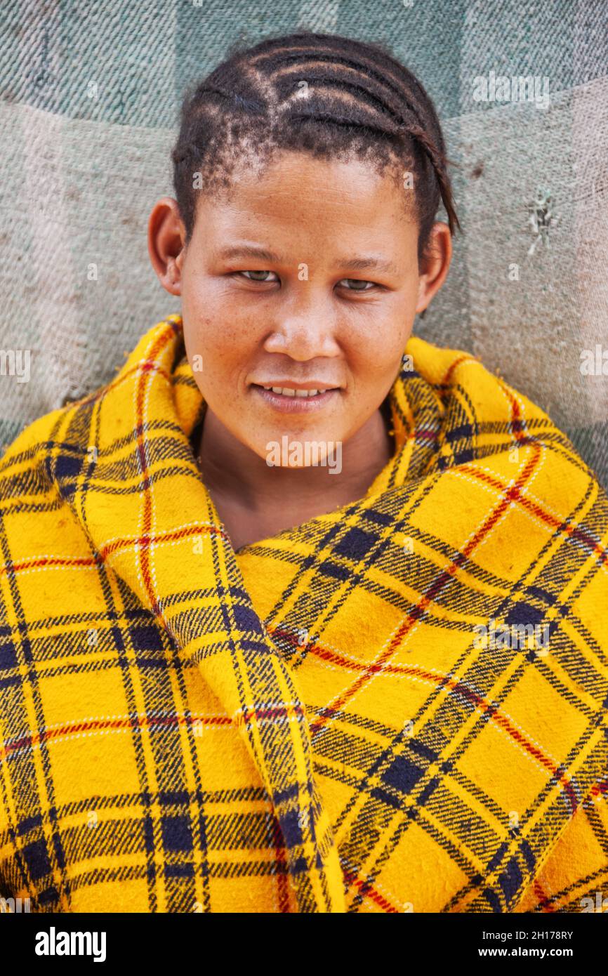 young basarwa girl with braids and yellow blanket Stock Photo - Alamy