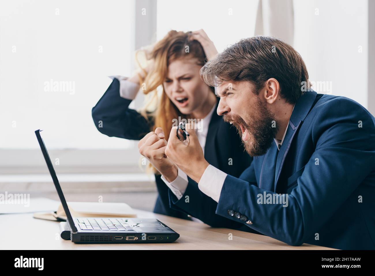 colleagues sitting in front of a laptop teamwork technologies Stock ...