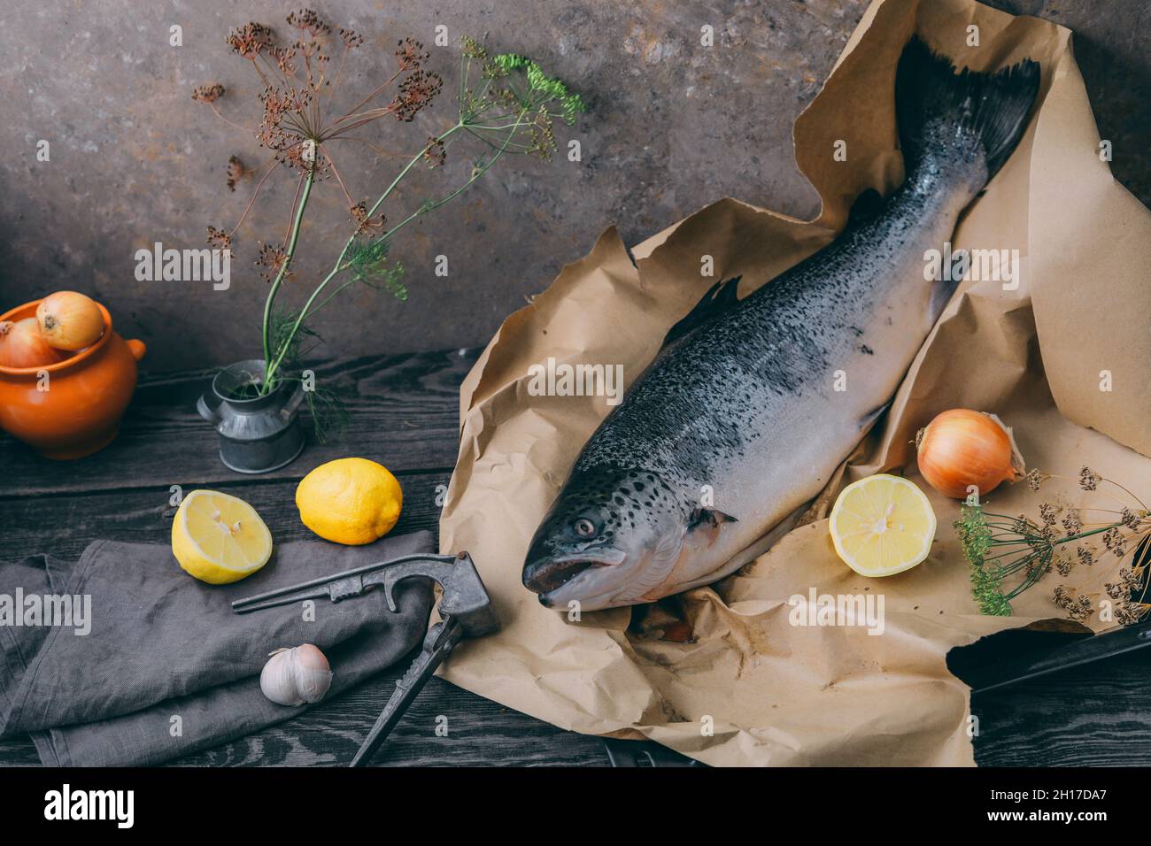 Still life with fish and vegetables on a kitchen wooden table Stock ...