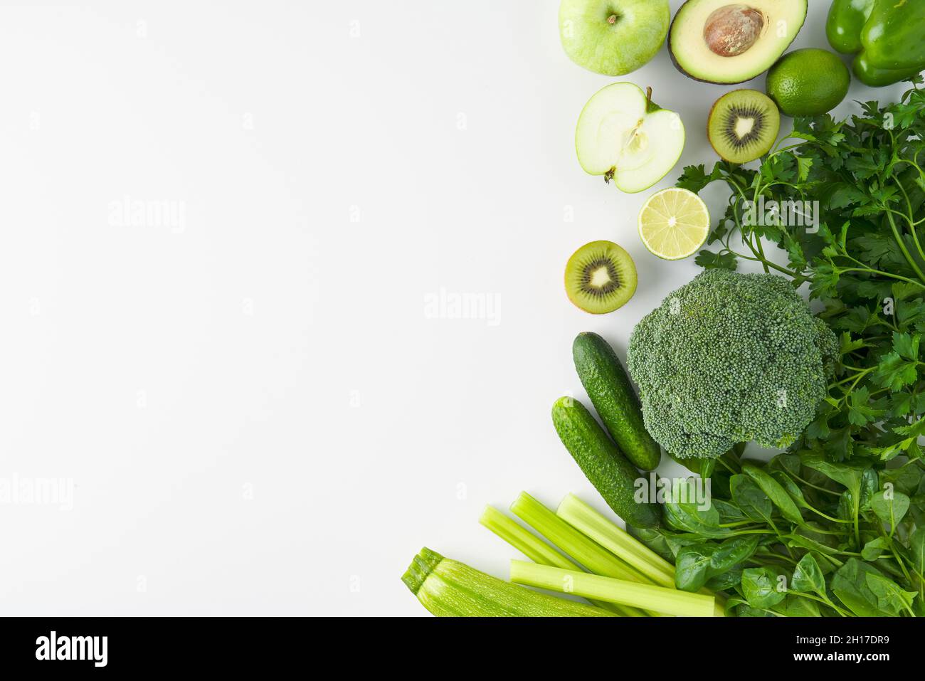 Vegetarian set of broccoli, celery, cucumber, pepper, apple, kiwi, lime ...