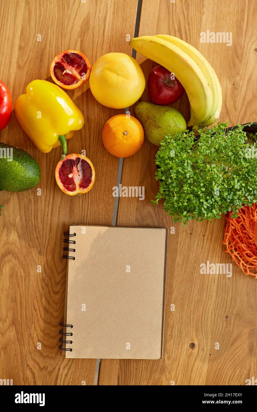 Planning notebook, writing weekly meals on a meal planner note or diet ...