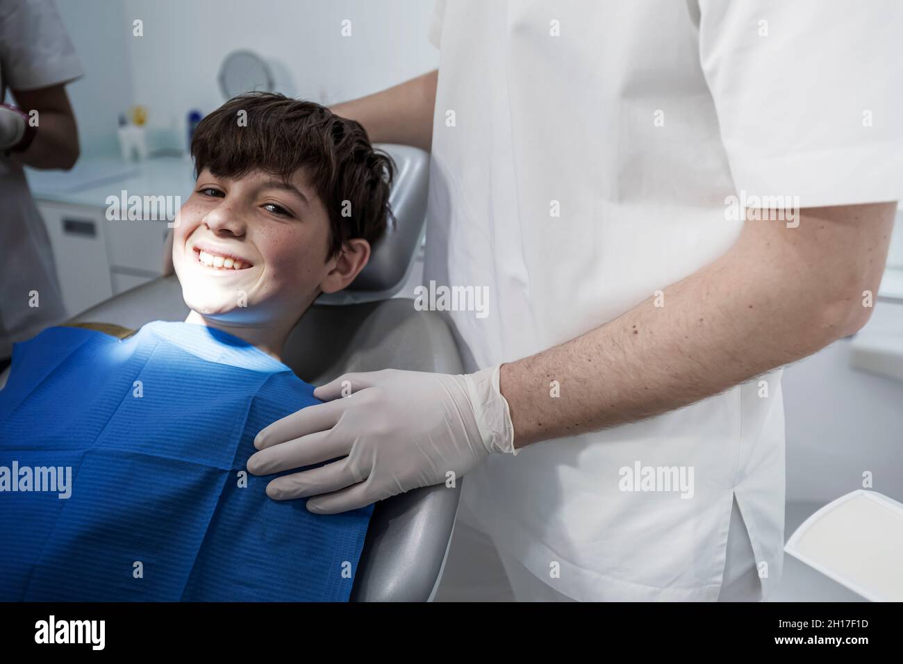 A cute boy is being examined by a professional pediatric dentist. Very ...