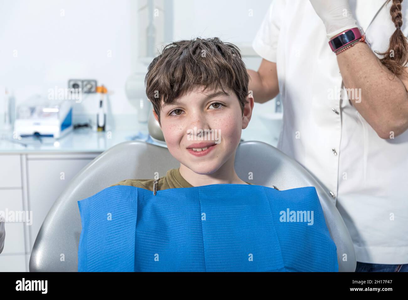 A cute boy is being examined by a professional pediatric dentist. Very ...