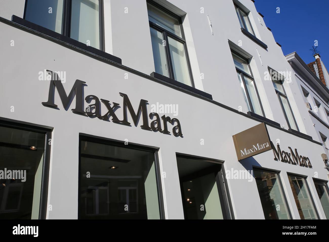 Brugge, Belgium - October 9. 2021: Closeup of store front with logo ...