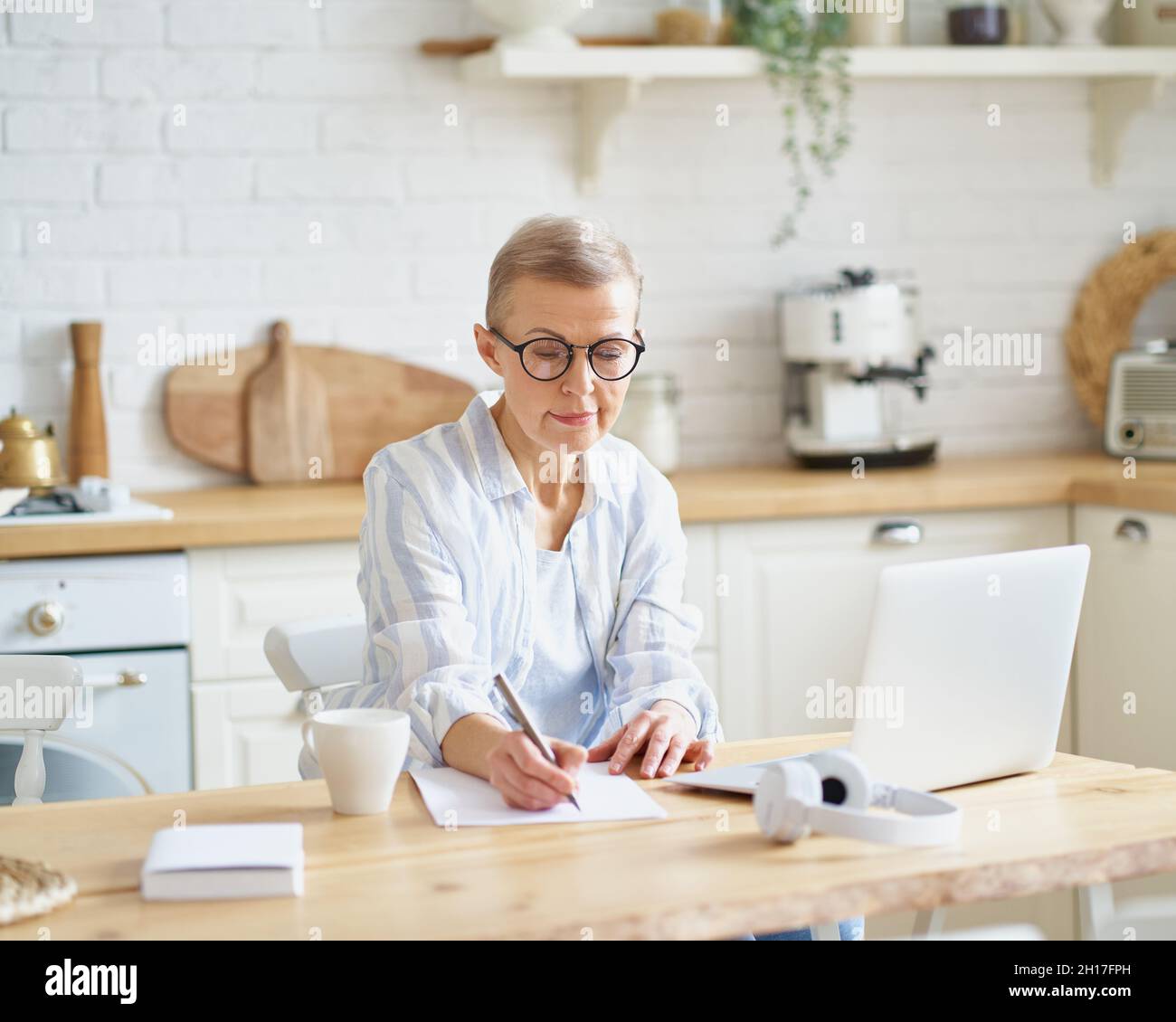 Woman working focused on laptop hi-res stock photography and images - Alamy