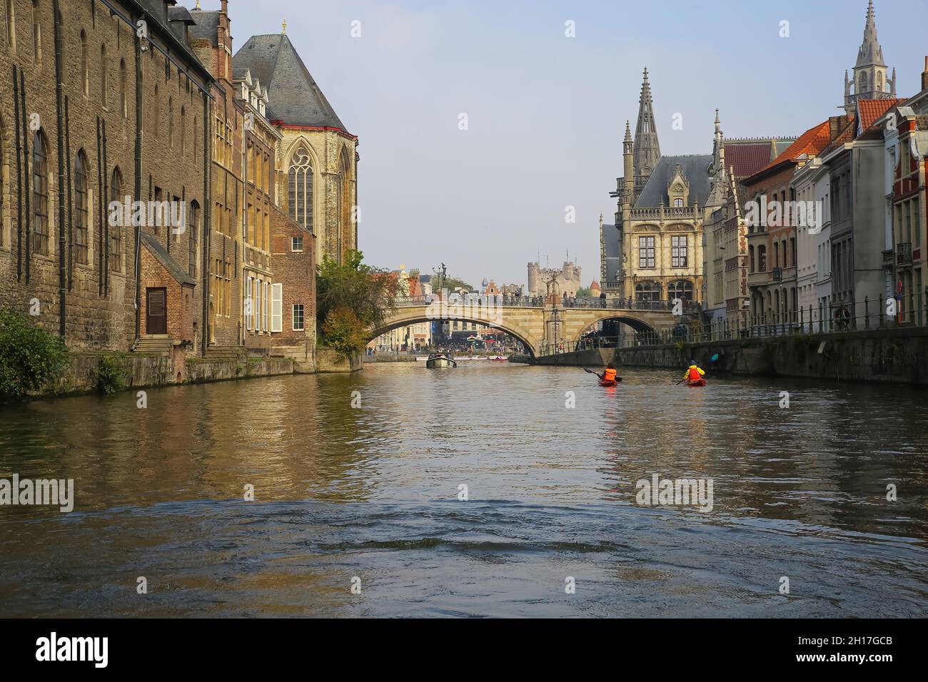 Gent, Belgium - October 9. 2021: View over water canal beyond medieval ...