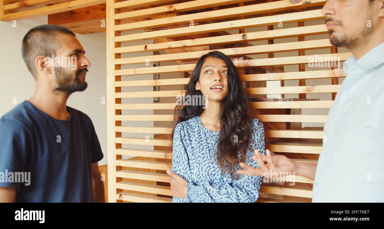 A group of Indian friends in a living room, talking and laughing Stock ...