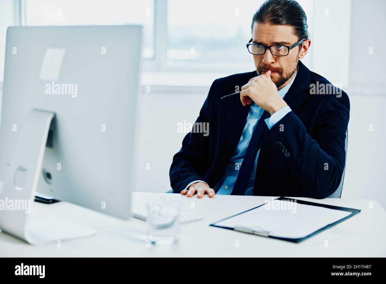 The man in a suit in the office gestures with his hands Lifestyle Stock ...
