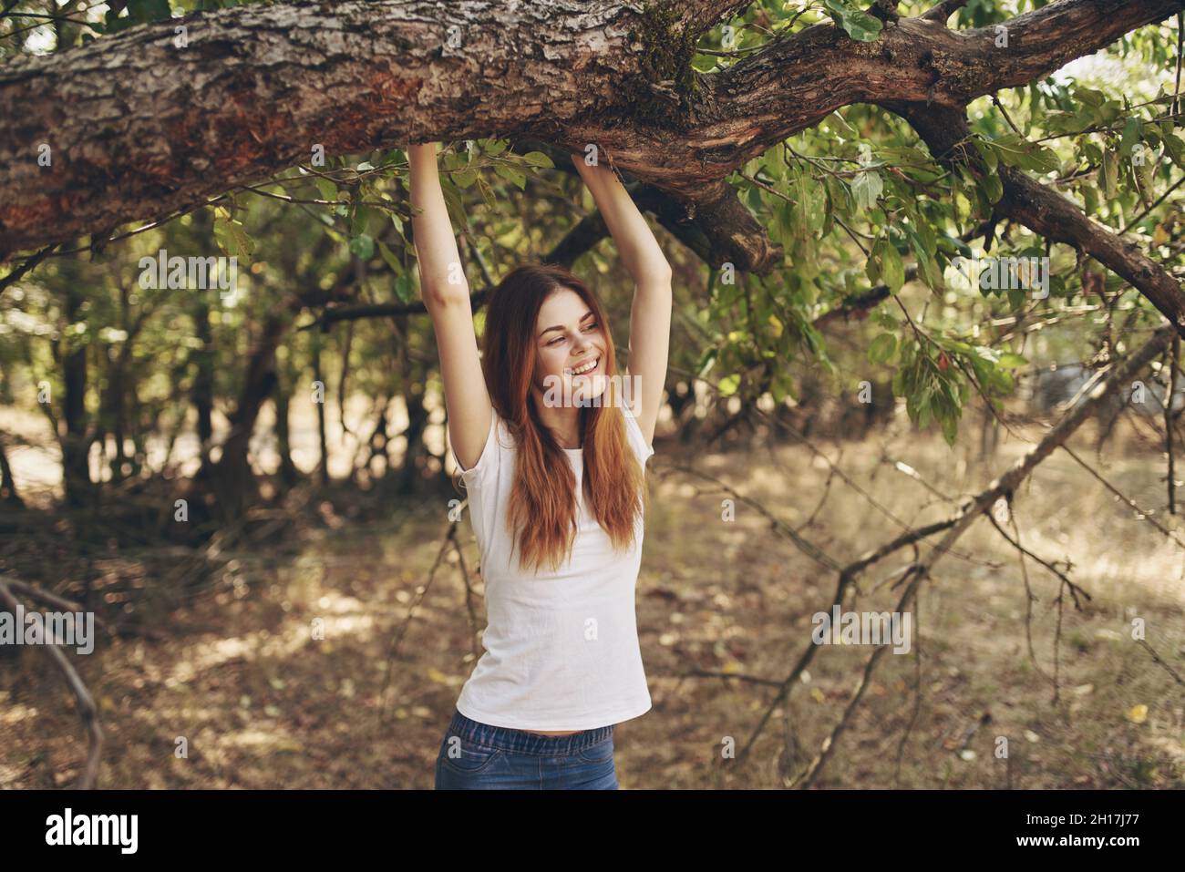 pretty woman outdoors by the tree Sun freedom journey Stock Photo - Alamy