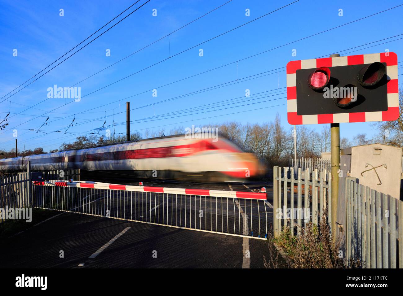 Azuma train passing Red lights at an unmanned Level crossing, East ...
