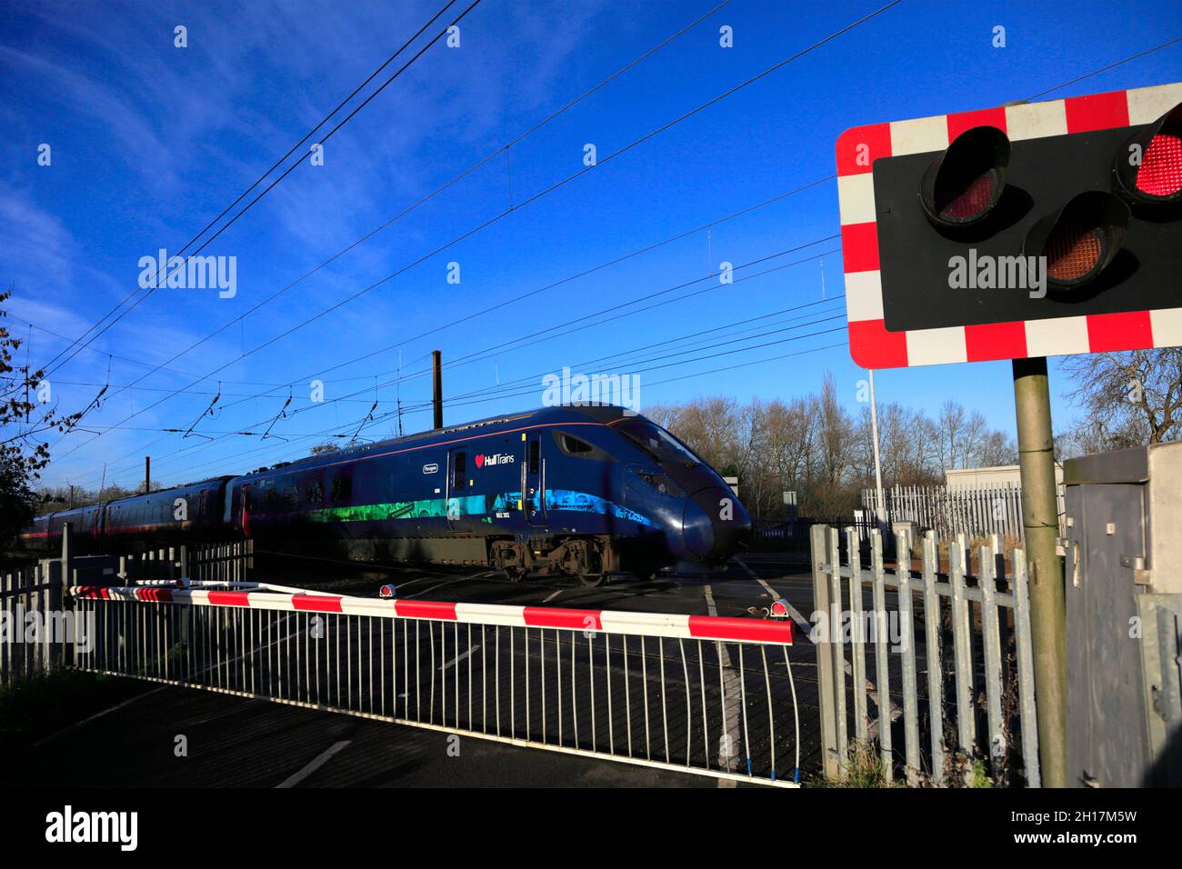 Hull Trains Paragon train passing red lights at an unmanned Level ...