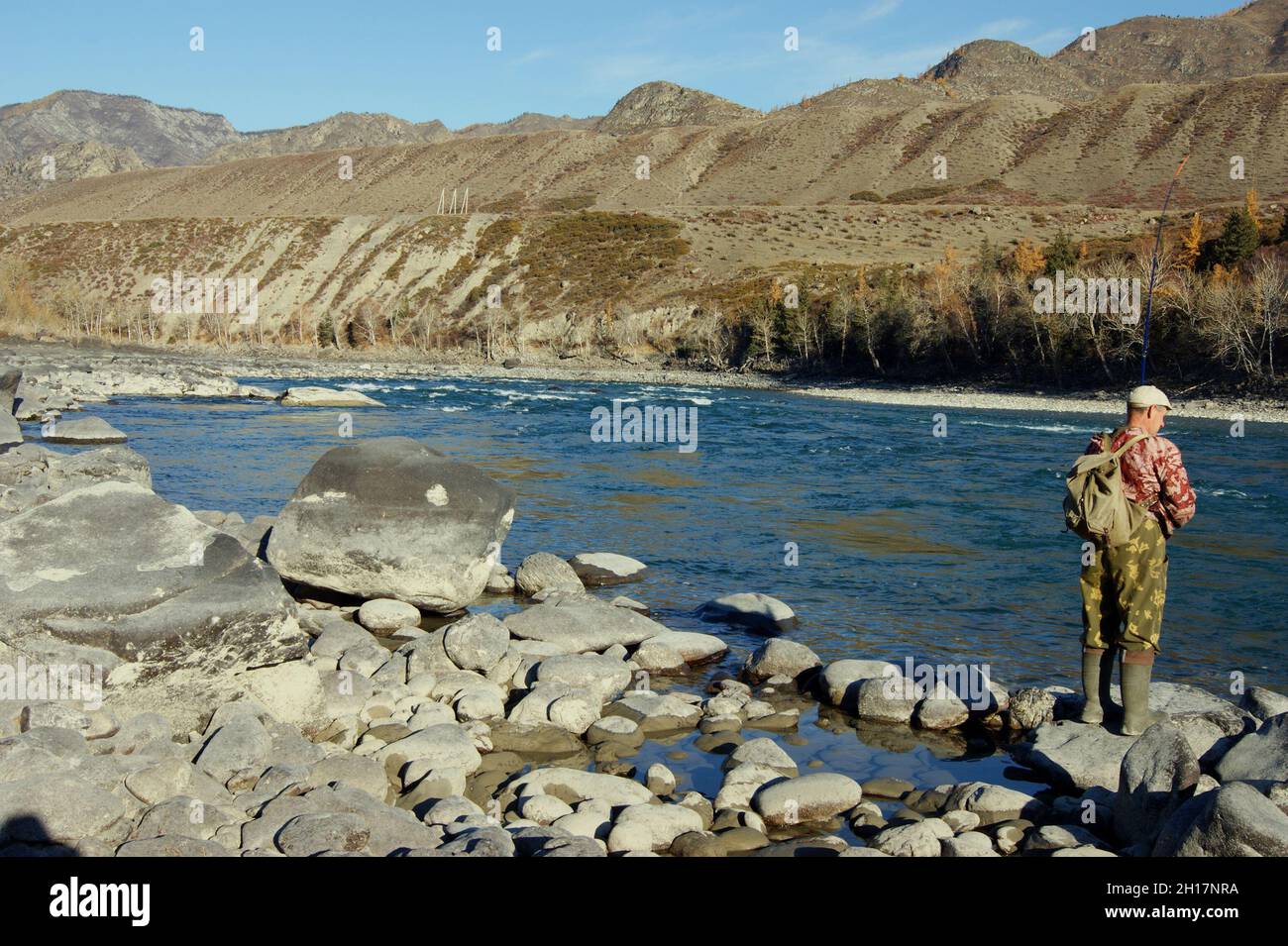 Man goes fishing in beautiful river in mountain Stock Photo - Alamy