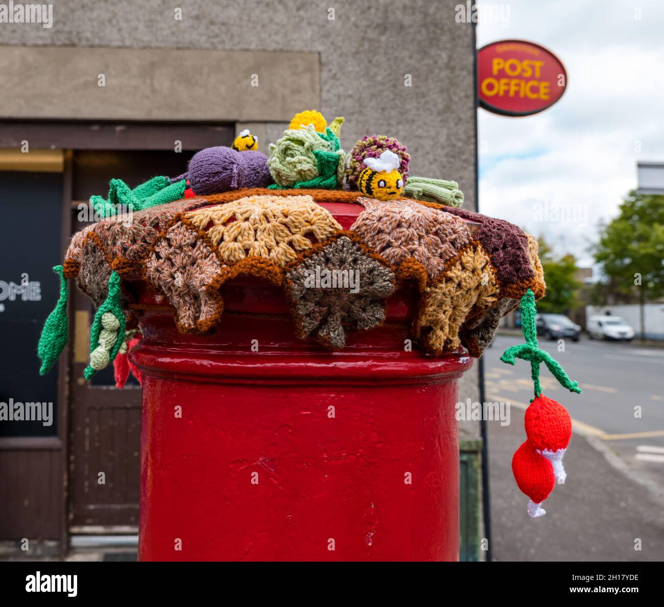 Knitted and crocheted harvest decoration on Royal Mail postbox ...