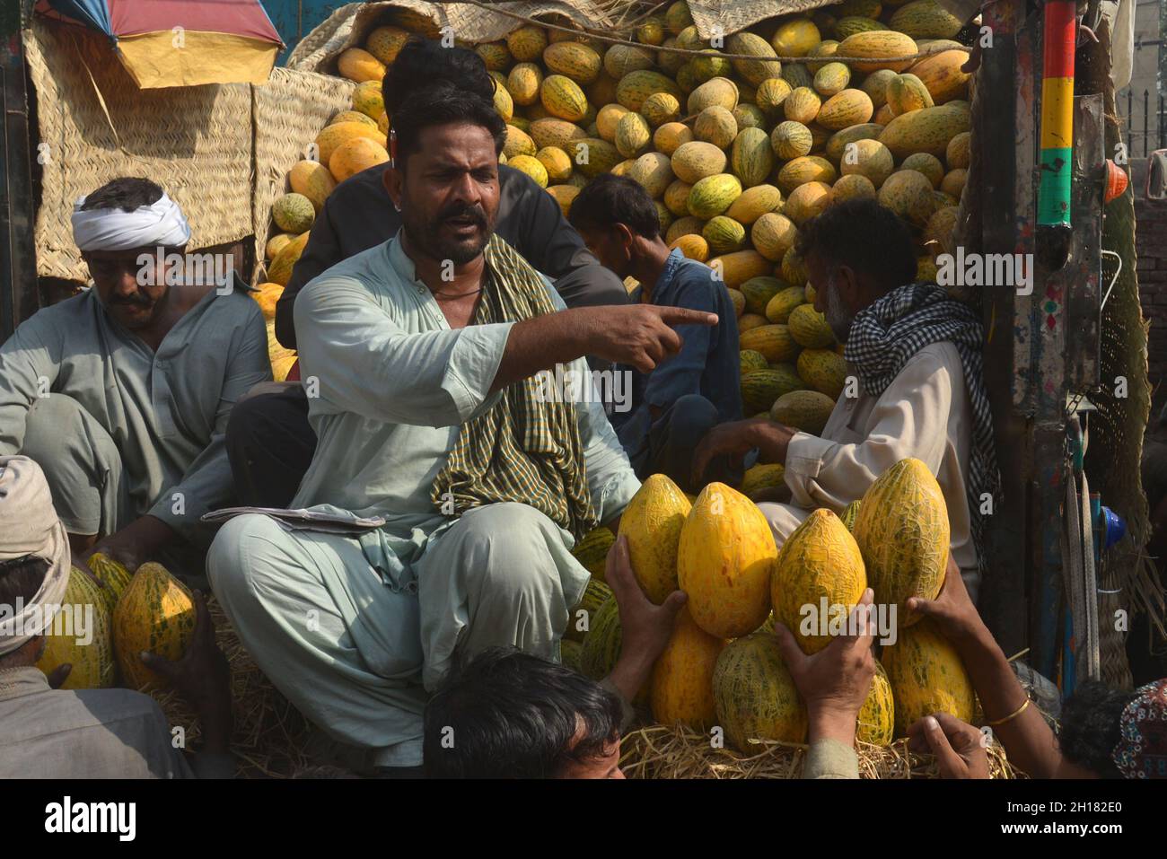 Pakistani People are buying Sweet lemons and cantaloupe melon on whole ...