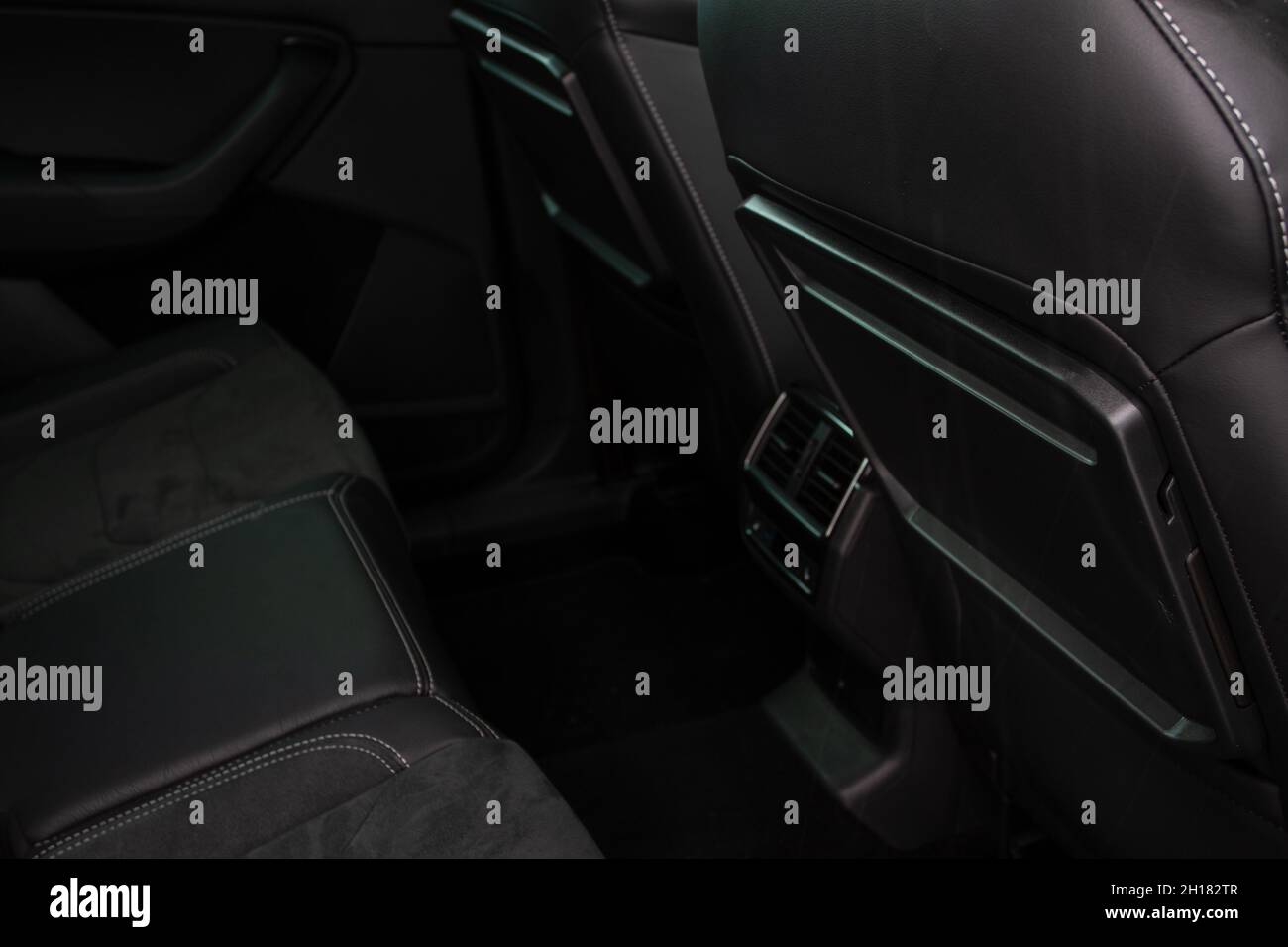 Car folding table inside modern car interior. Folding table on the back ...