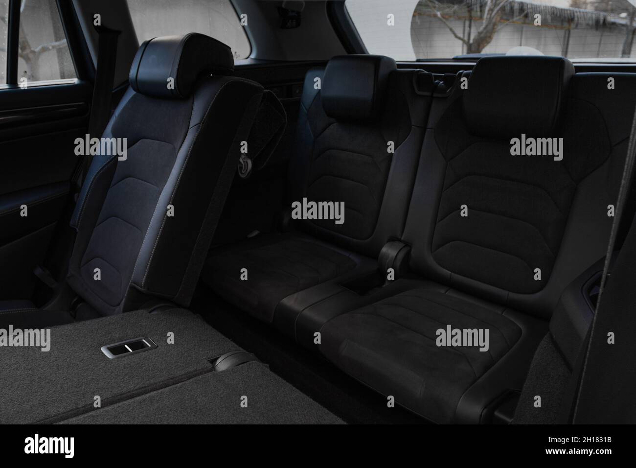 Folding seats and a cargo space inside suv car. Modern car interior ...